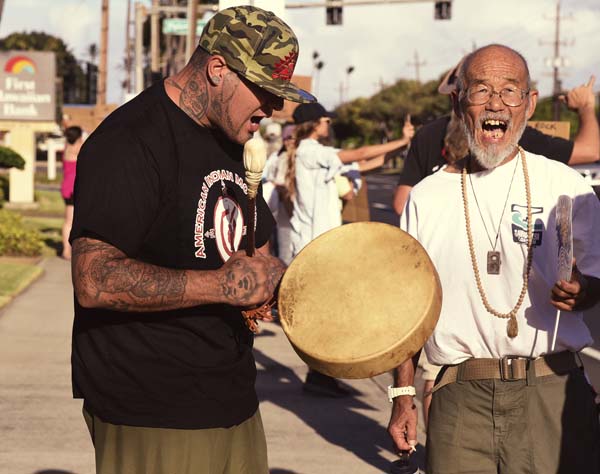 Banging the drum, waving a sign in protest | News, Sports, Jobs - Maui News